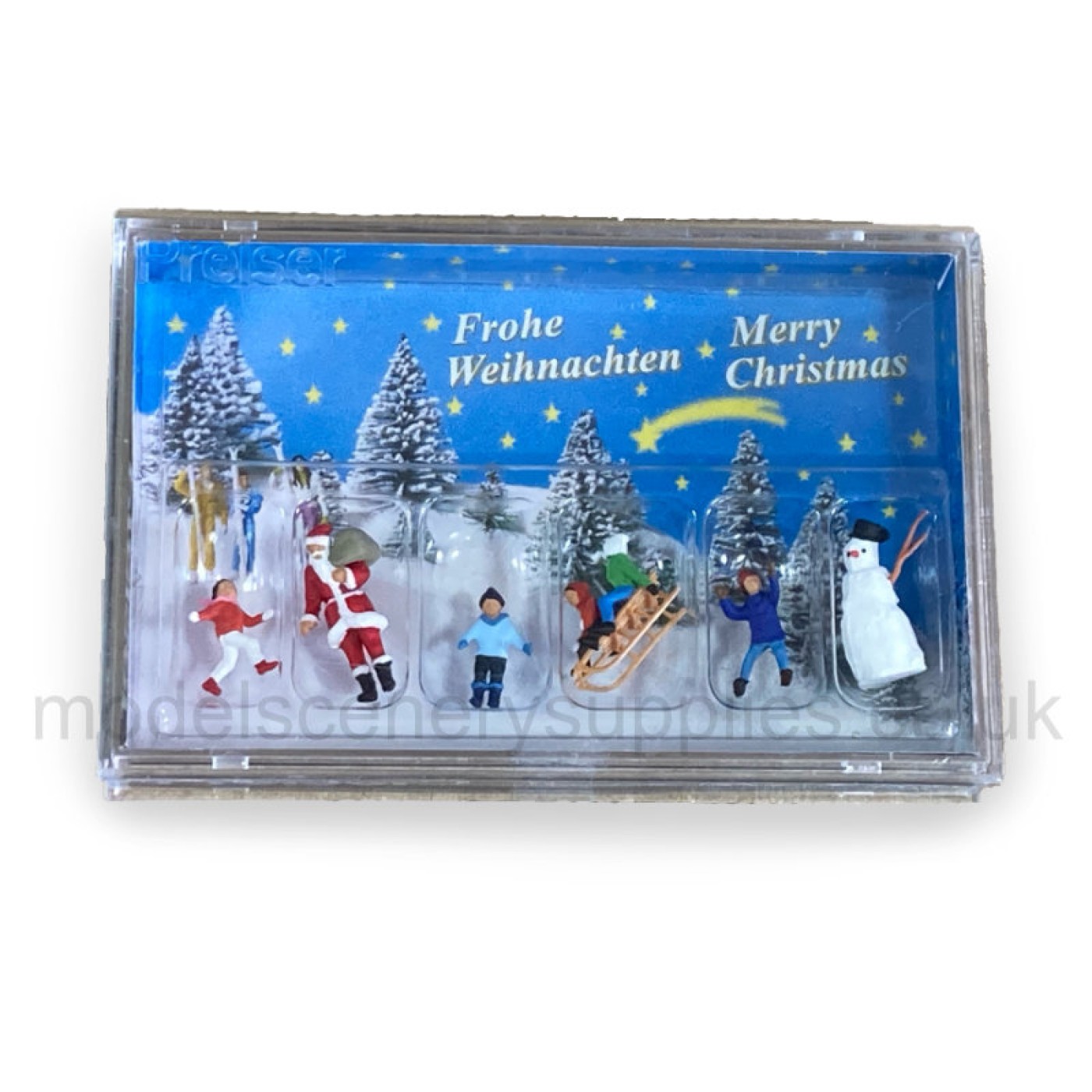 Model Father Christmas with Children playing in the snow